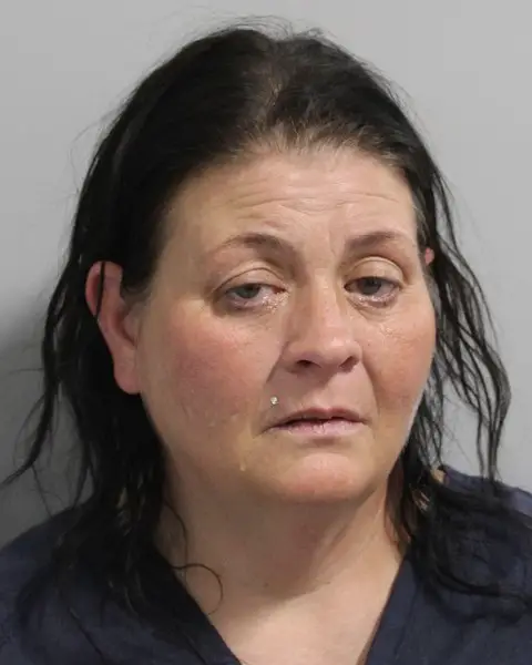 AMY SUTTON booked for